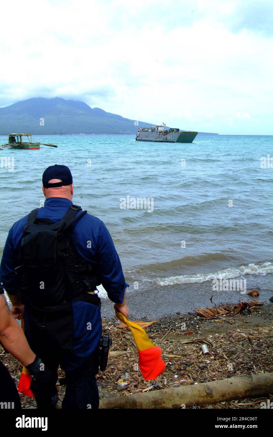 US Navy Ens. prepares to flag down Landing Craft Utility One Six Two ...