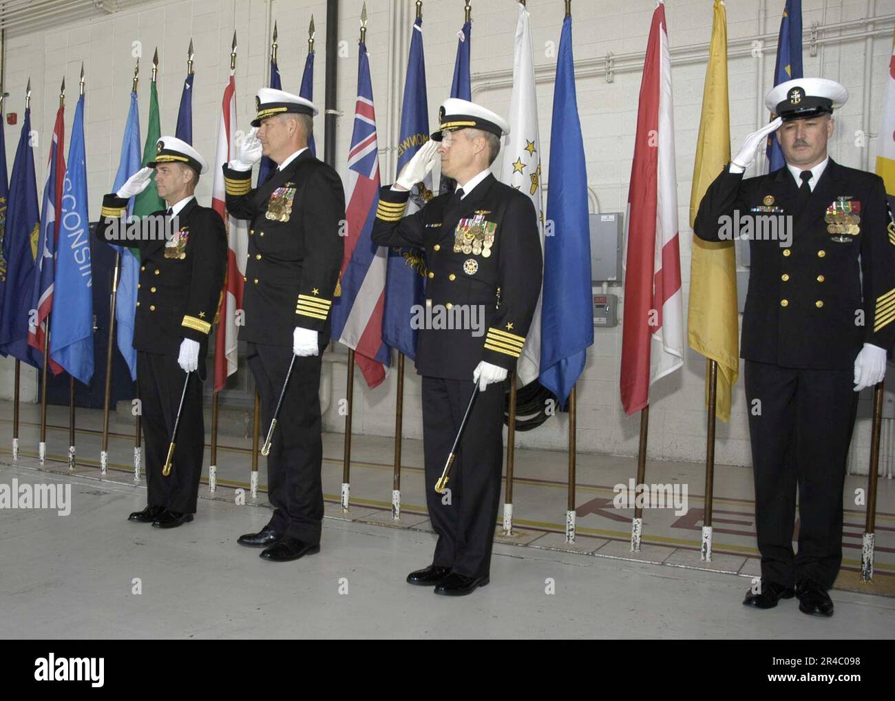 US Navy Distinguished guest and leadership salute the colors during the ...