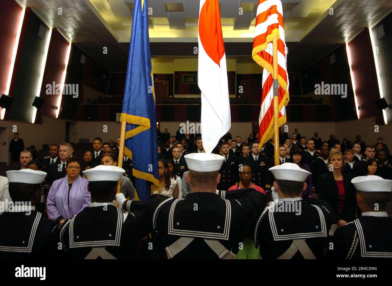 US Navy Sailors render flag honors during a traditional Navy retirement ...
