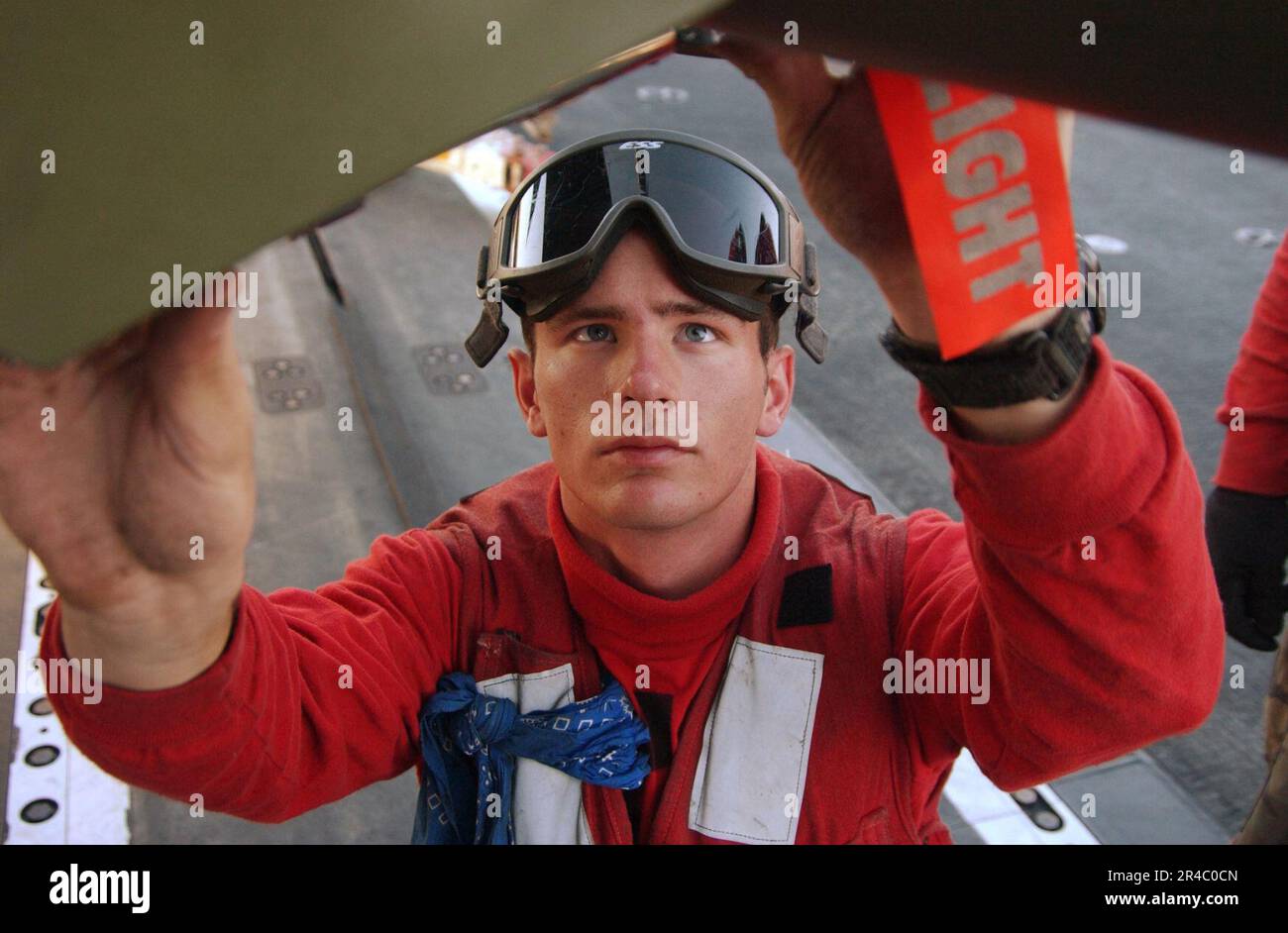 US Navy Aviation Ordnancemen Airman assigned to the ''Eagles'' of ...