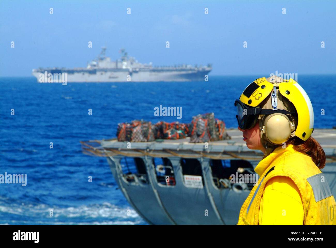 US Navy Landing Signal Enlisted (LSE), Gunner's Mate 3rd Class prepares ...