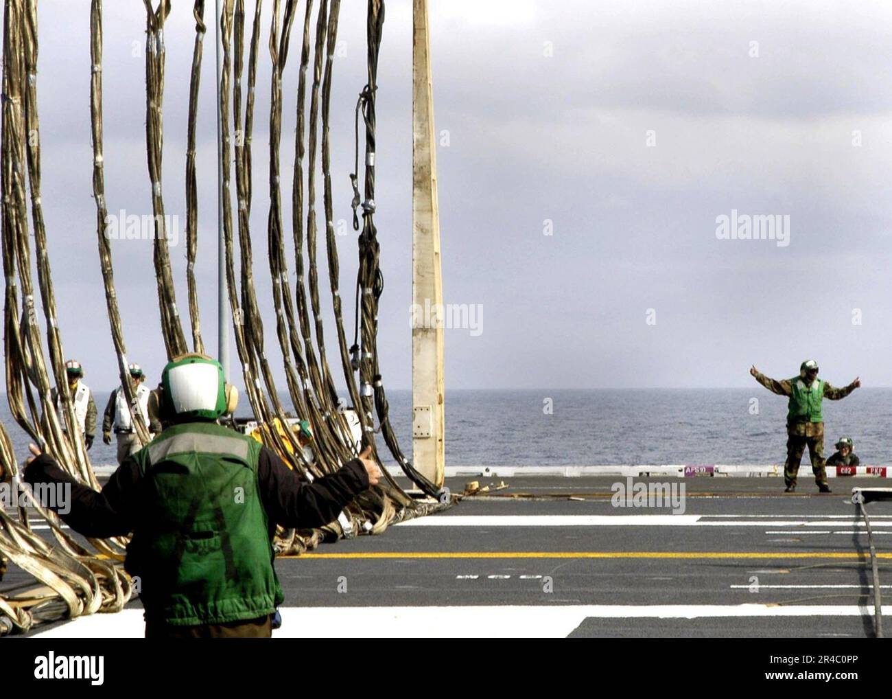 US Navy Air Department Sailors conduct flight deck drills with the ...