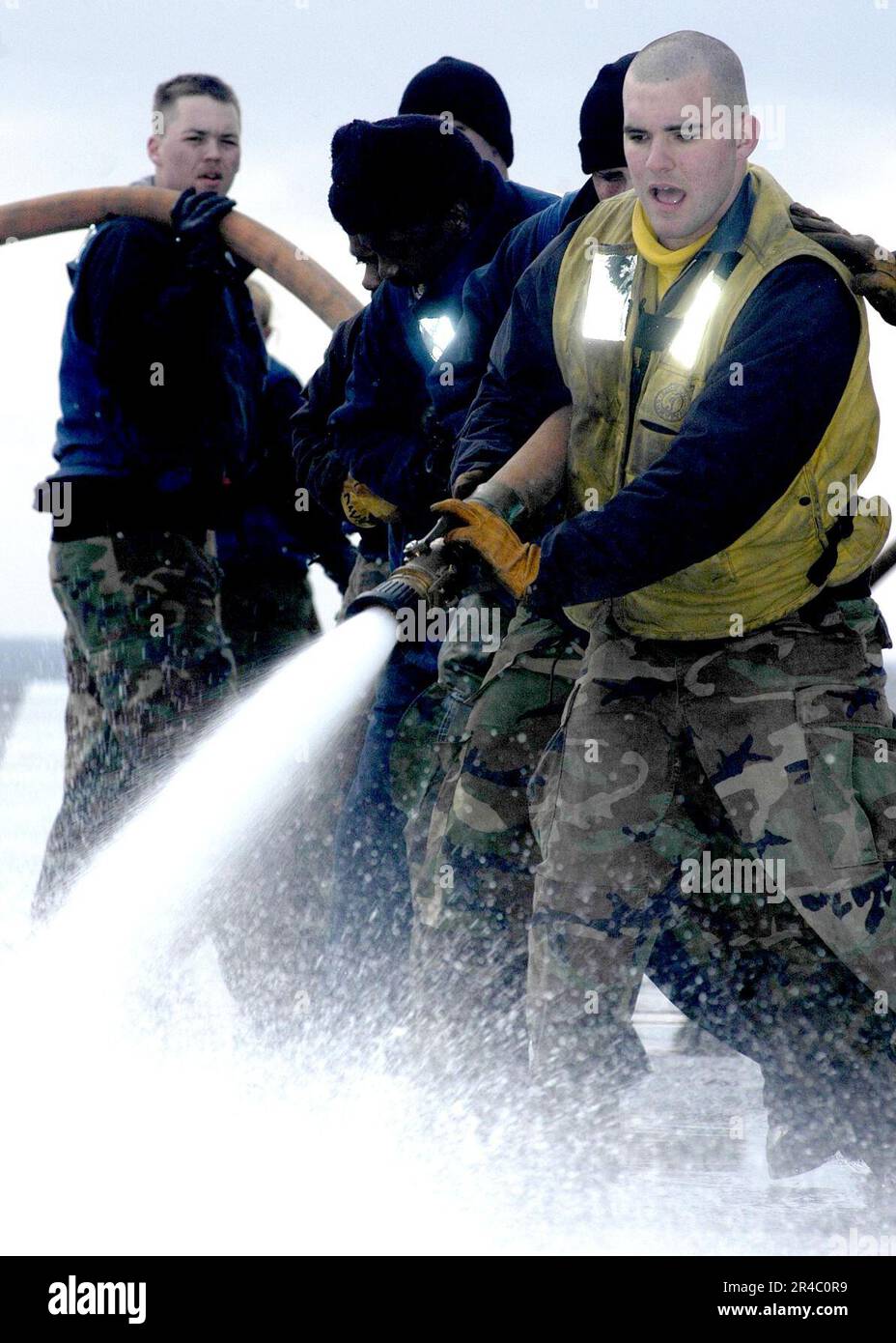 US Navy Air Department Sailors test the counter measure wash down ...