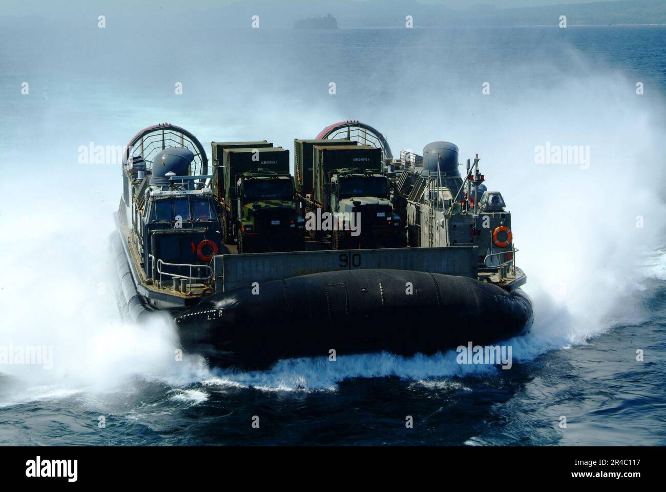 US Navy A Landing Craft, Air Cushion (LCAC) loaded with equipment from the 31st Marine Service ...
