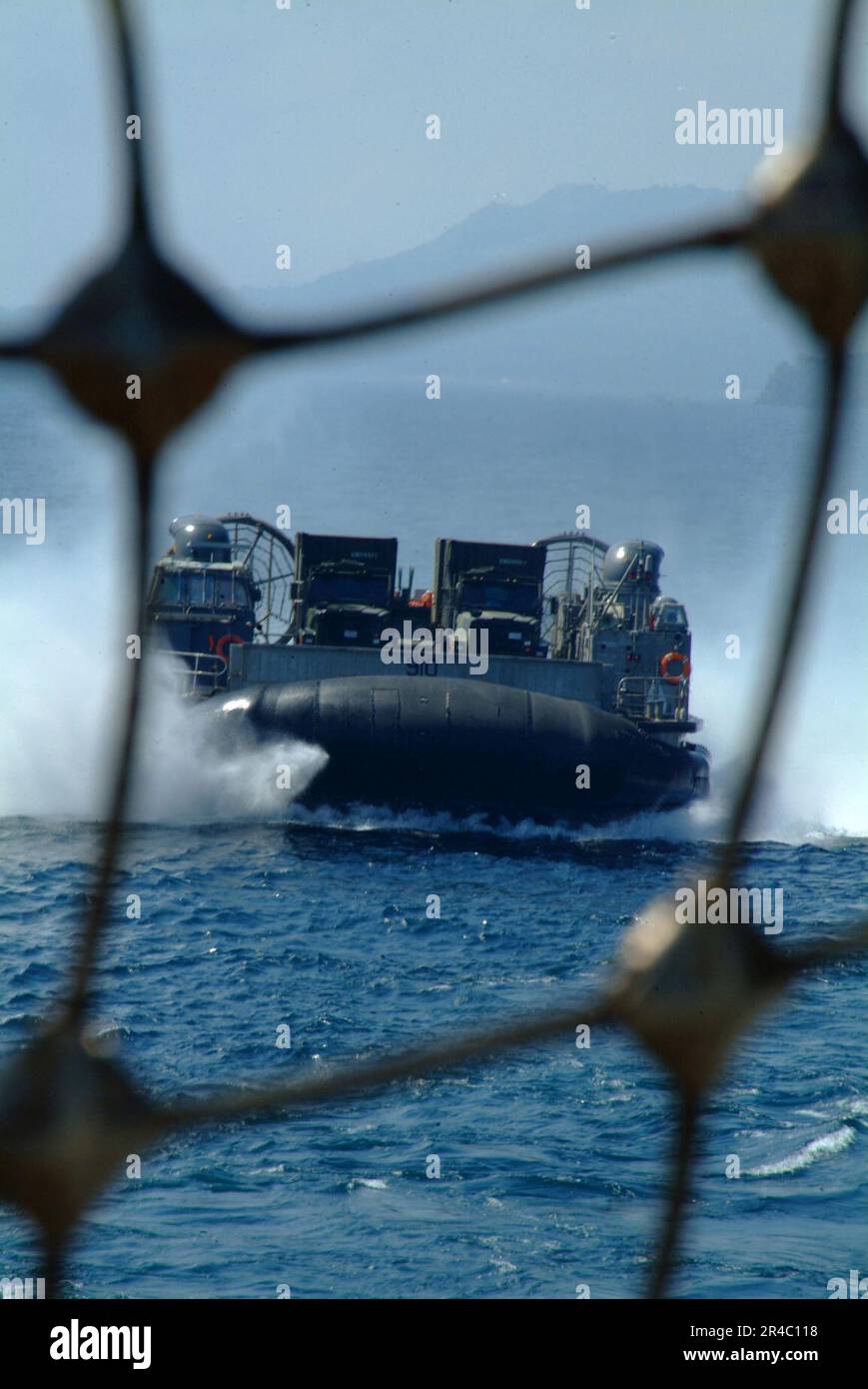 US Navy A Landing Craft, Air Cushion (LCAC) loaded with equipment from ...