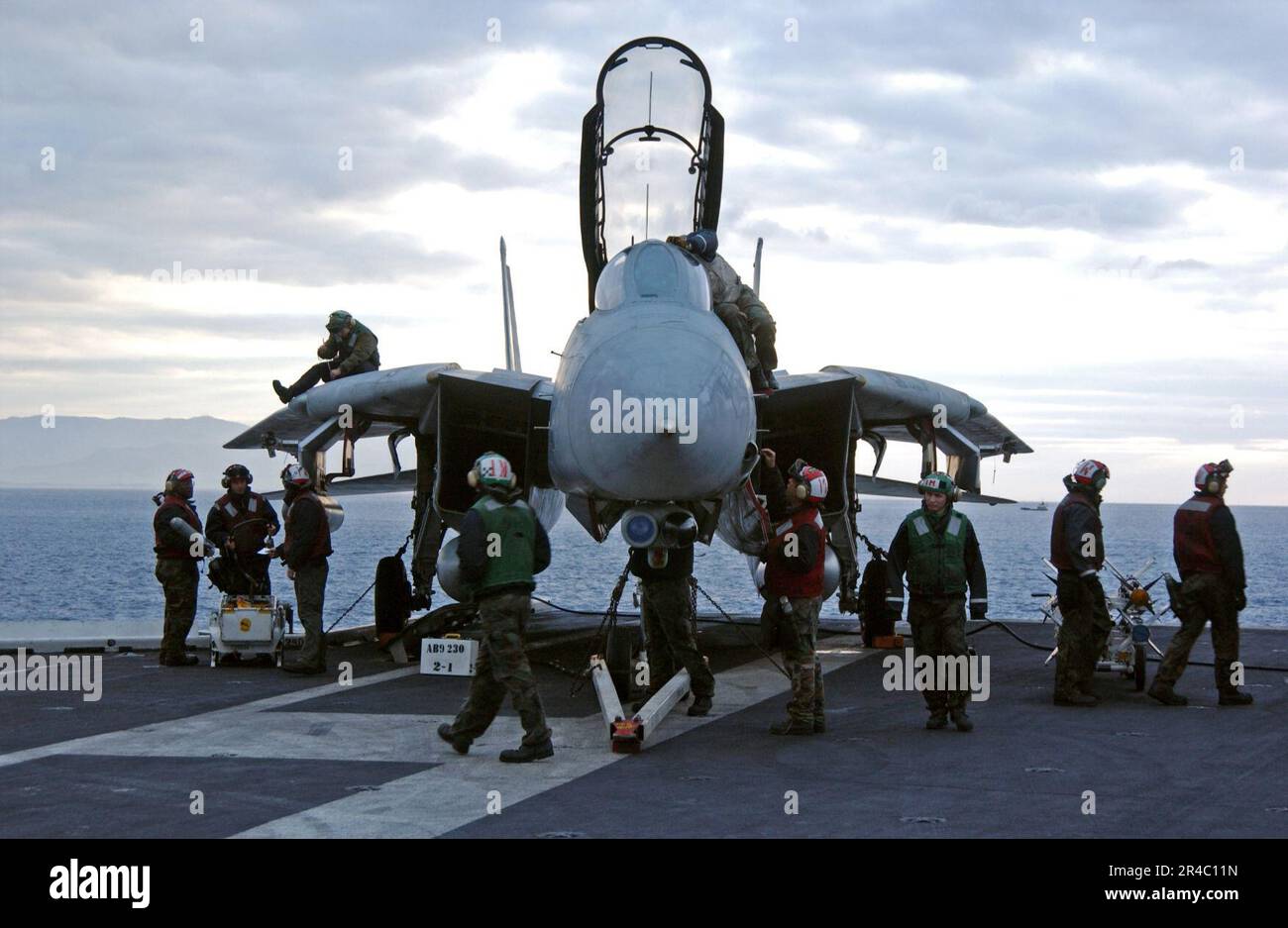 US Navy Squadron personnel conduct routine morning operations as they pass through the Strait of ...
