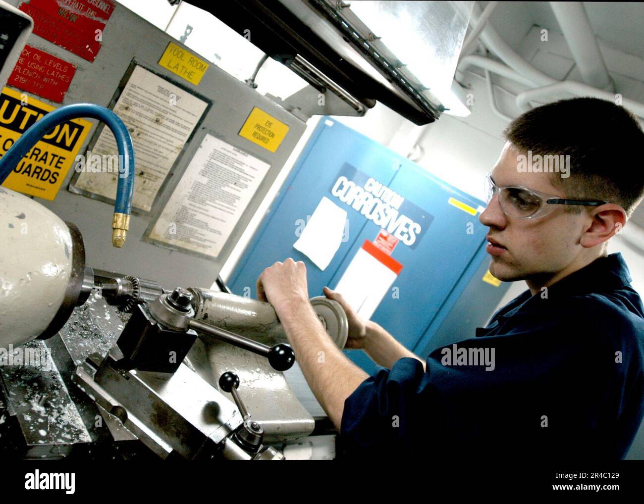 US Navy A fireman assigned to the Nimitz-class aircraft carrier USS ...