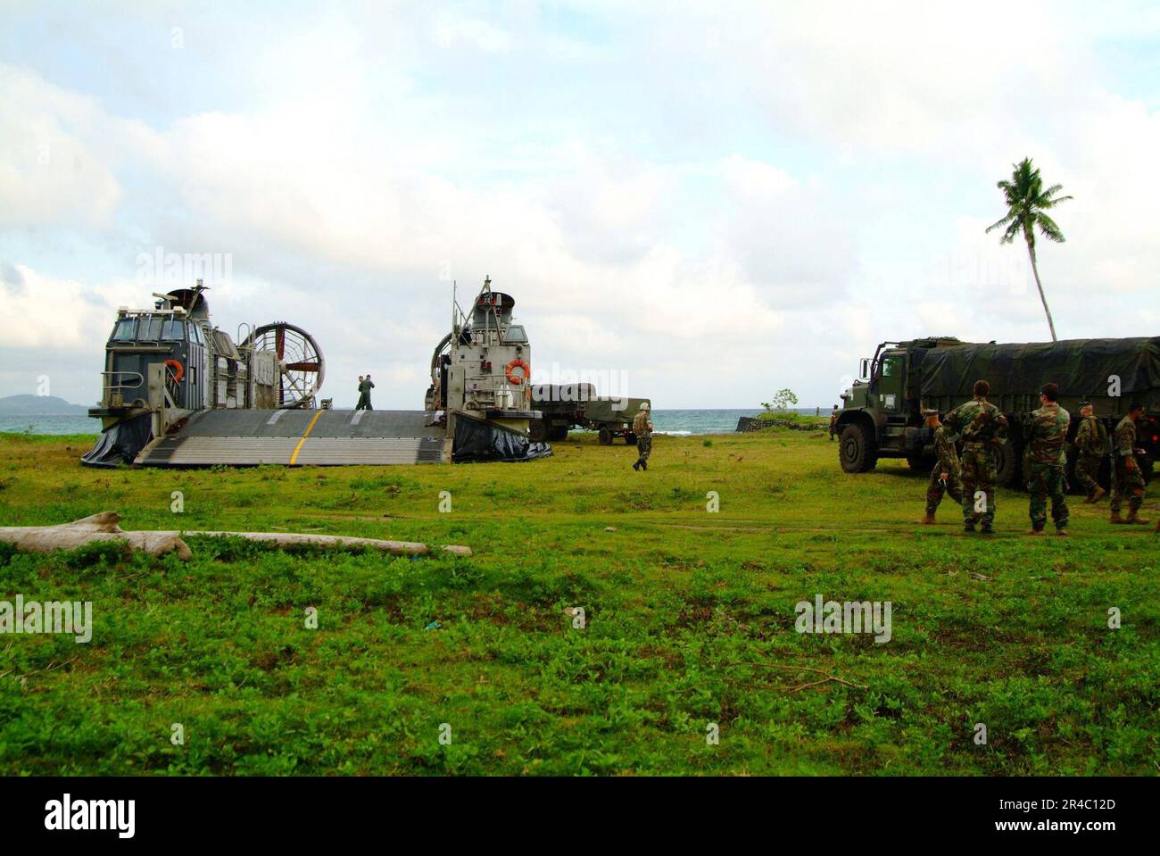 US Navy Marines assigned to the 31st Marine Service Support Group (MSSG) load equipment on a ...