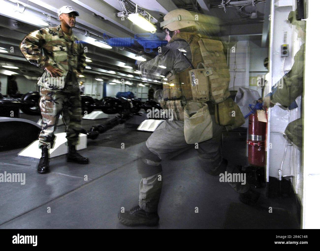 US Navy Master-at-Arms 2nd Class observes as ship security personnel ...