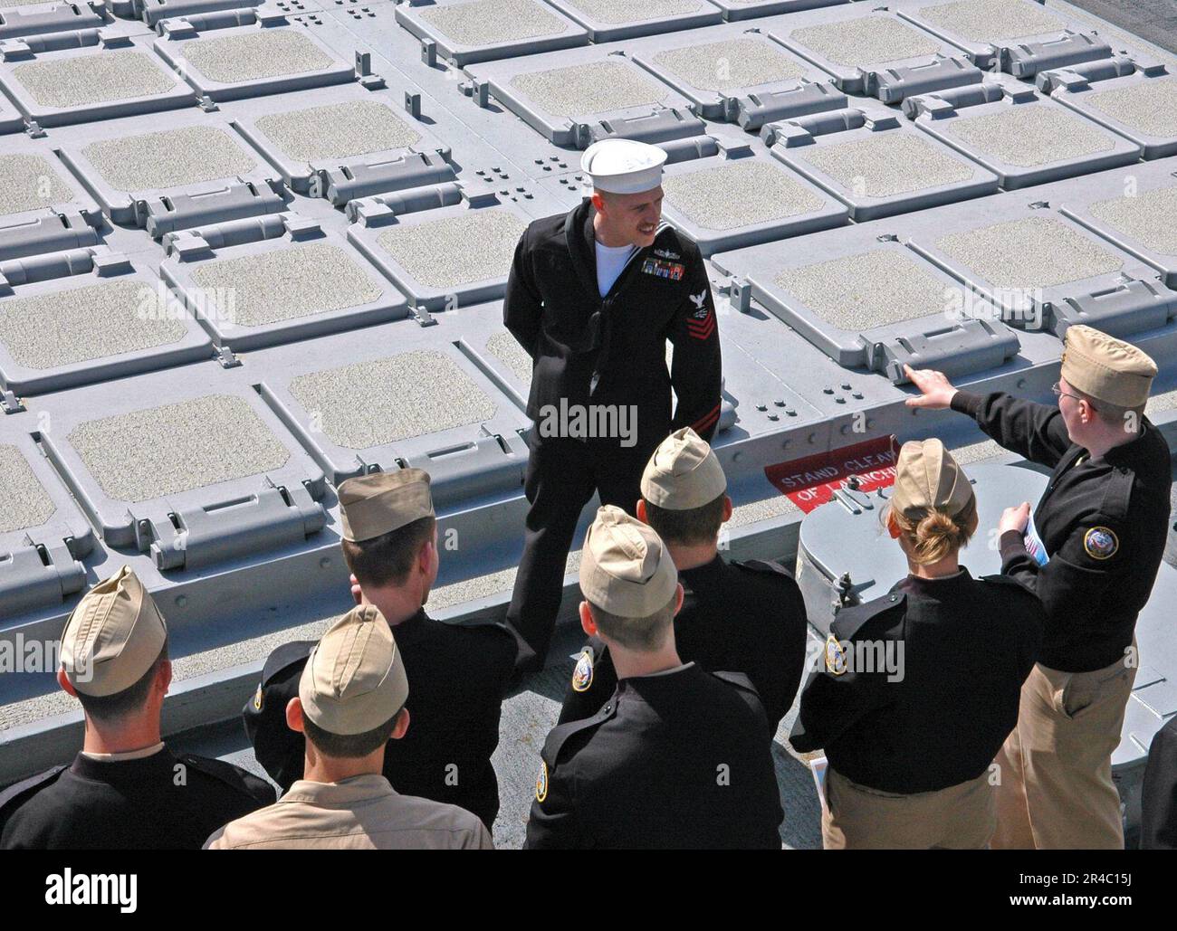 US Navy A Sailor assigned to the guided missile destroyer, USS Bunker ...