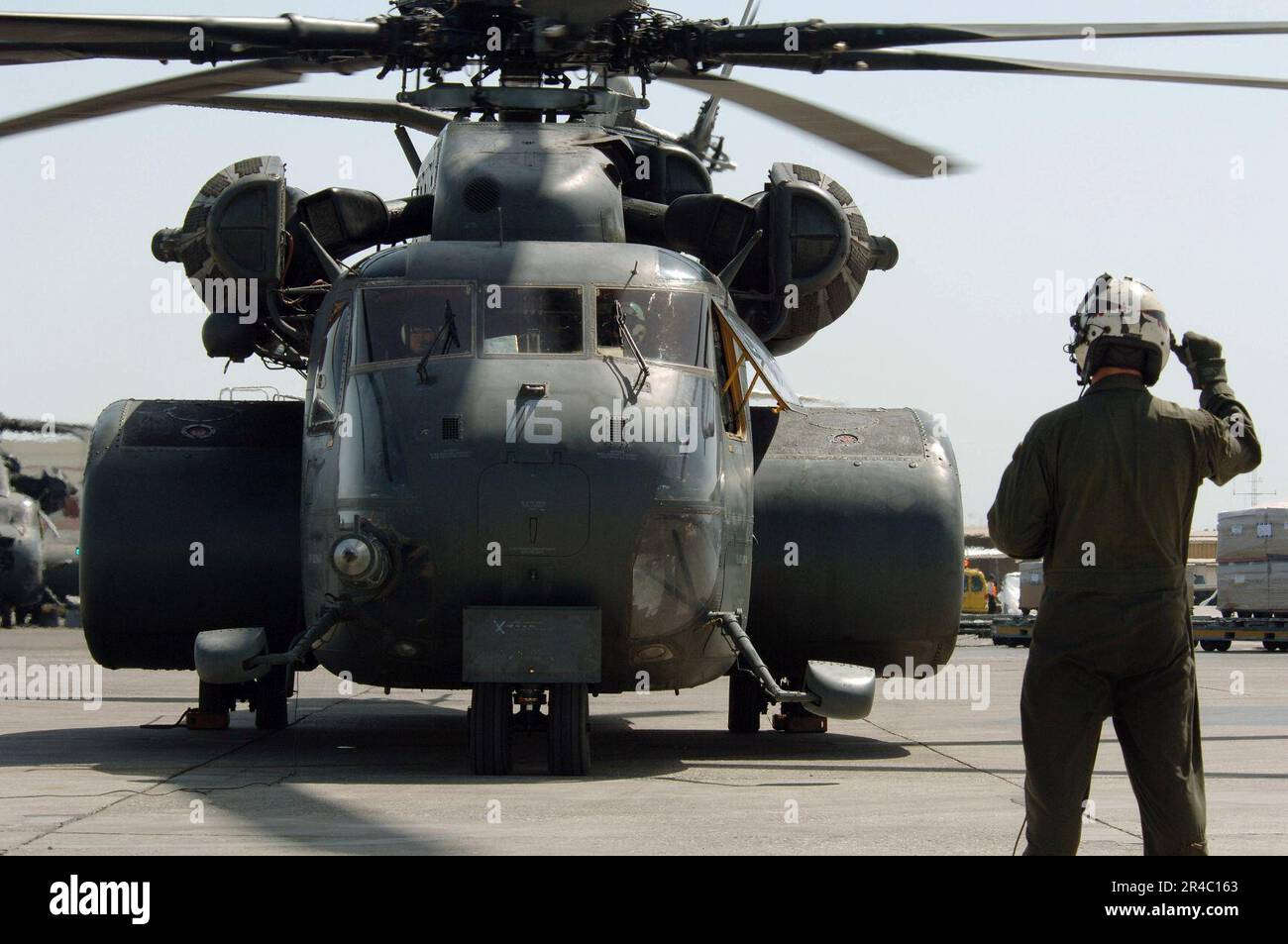 US Navy An Air crewman assigned to the Blackhawks of Helicopter Mine ...