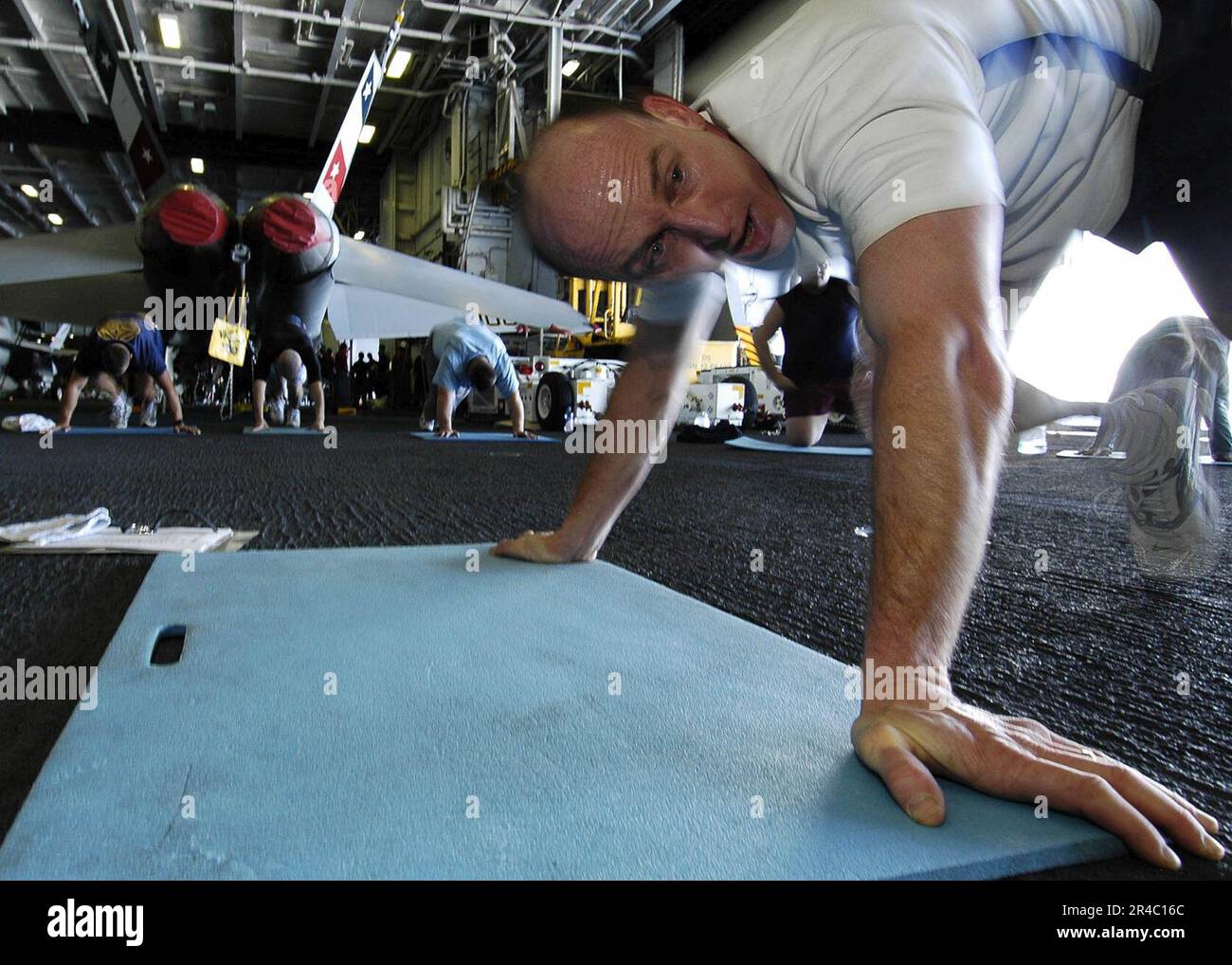 US Navy Chief Aviation Ordnanceman leads the G-3 weapons division in a ...
