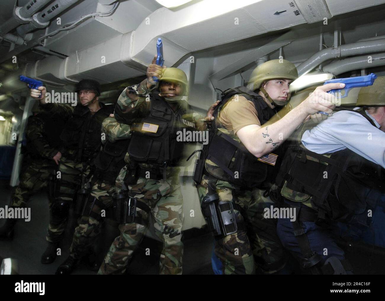 US Navy Security personnel move together as a ''stack'' during tactical ...