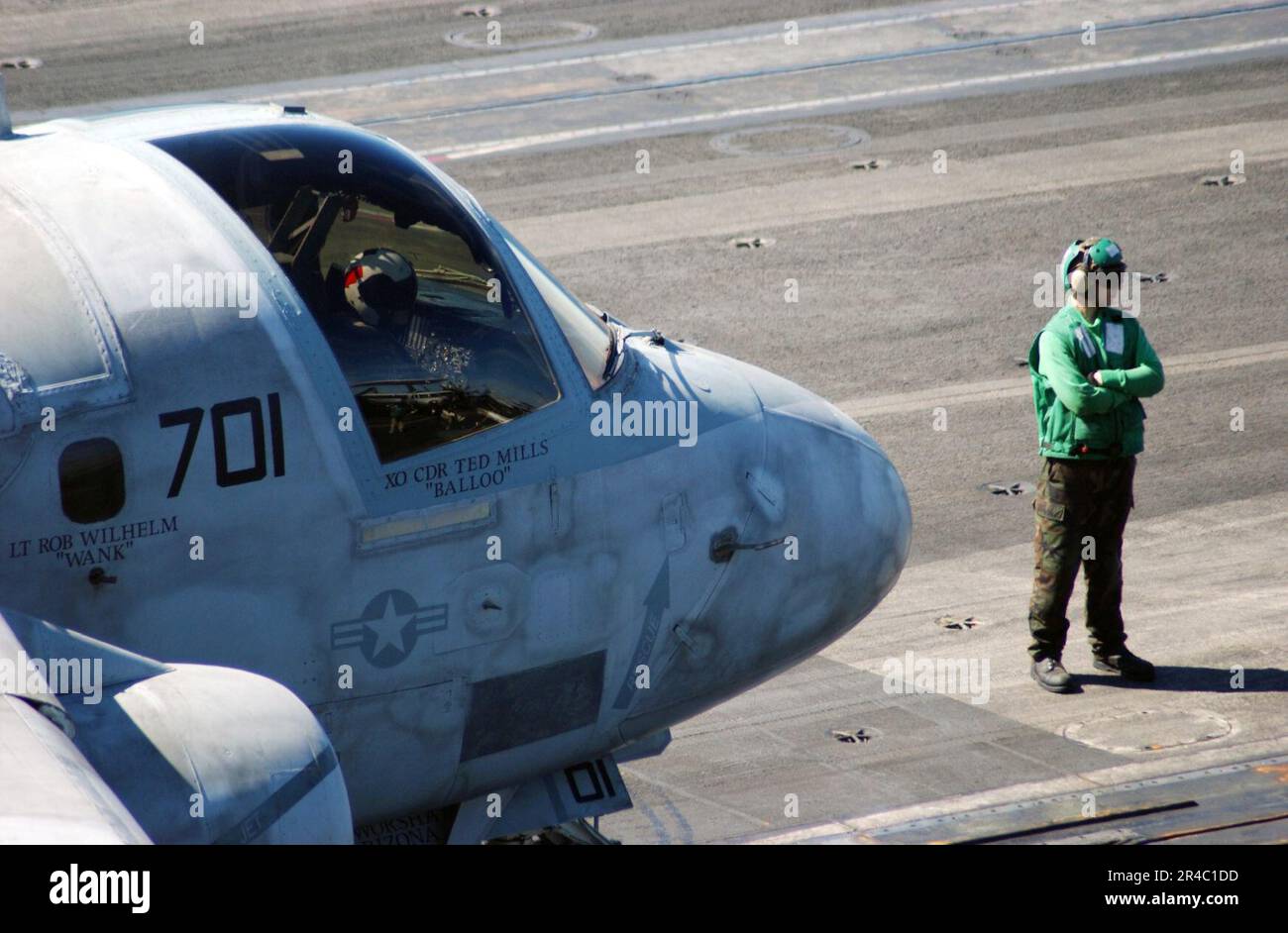 US Navy A flight deck crew member waits for an S-3B Viking assigned to ...