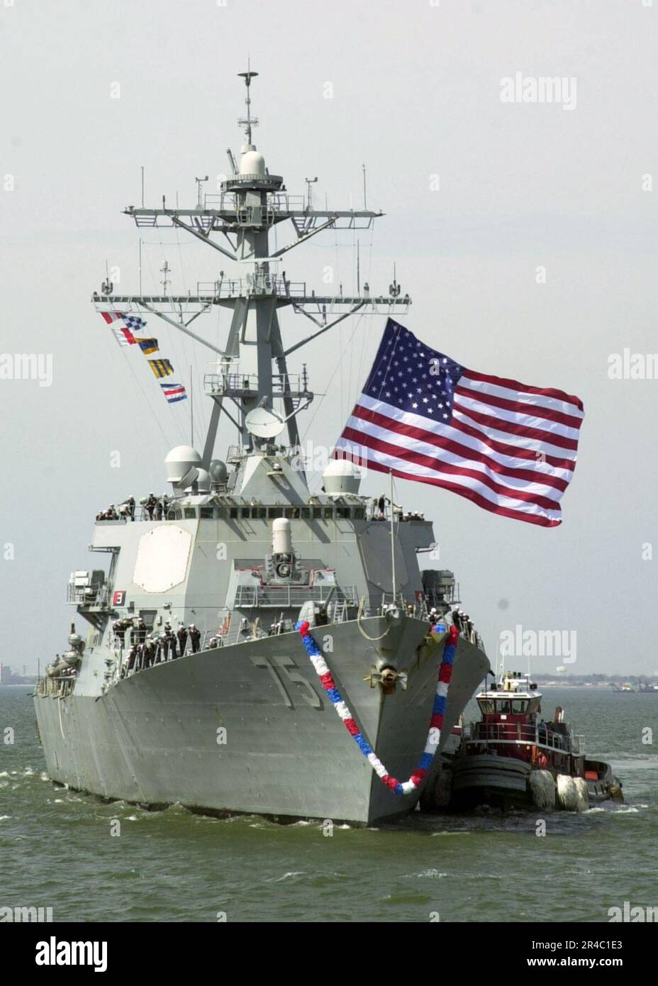 US Navy A tug boat assist the guided-missile destroyer USS Donald Cook ...