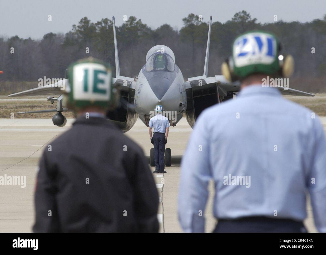 US Navy Plane captains wait to secure a F-14D Tomcat assigned to ...
