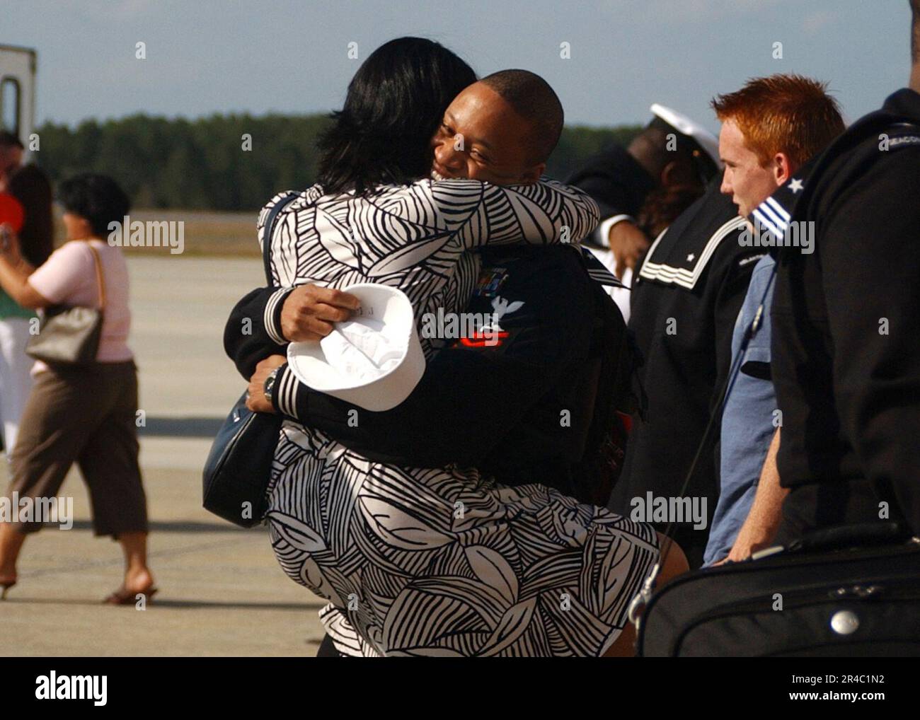 US Navy Aviation Maintenance Administrationman 1st Class hugs his wife ...