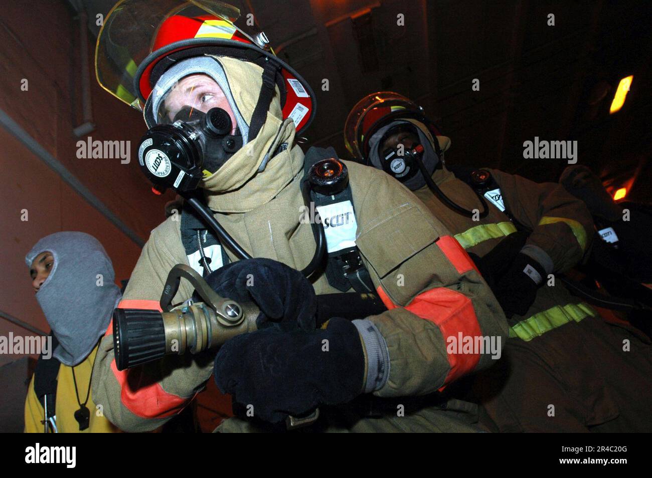 US Navy Sailors stationed aboard the Nimitz-class aircraft carrier USS ...