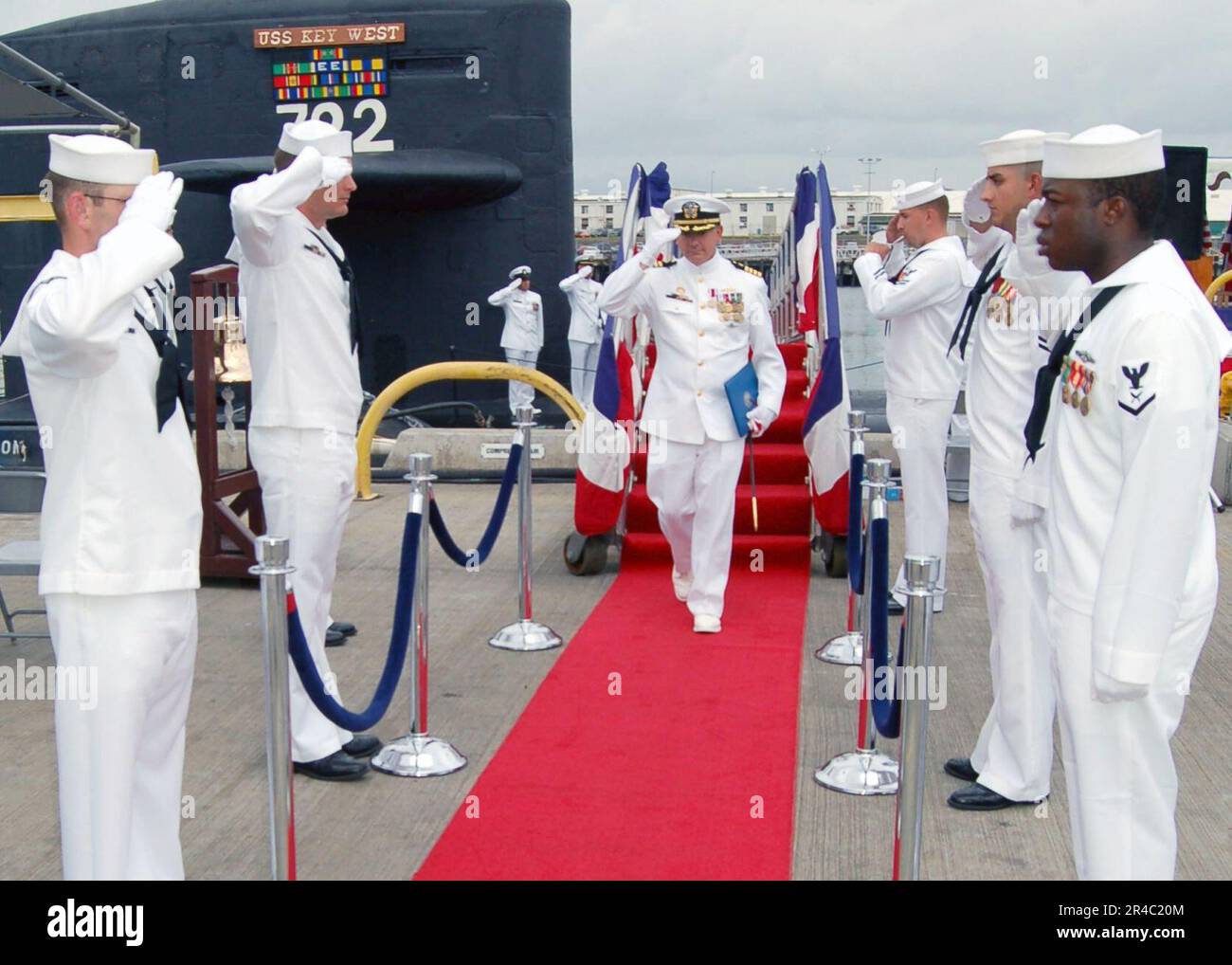 US Navy USS Key West (SSN 722) Sailors salute as sideboys, after Cmdr ...