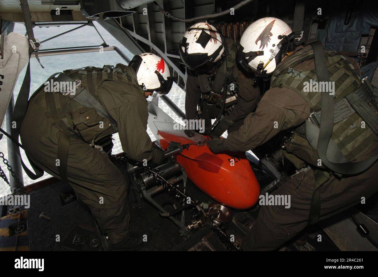 US Navy An air crewman assigned to the Blackhawks of Helicopter Mine ...