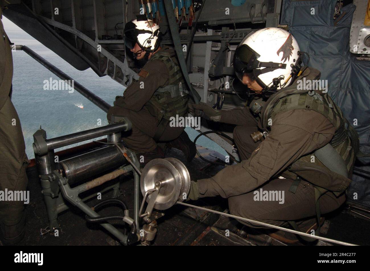 US Navy Air crewmen assigned to the Blackhawks of Helicopter Mine ...