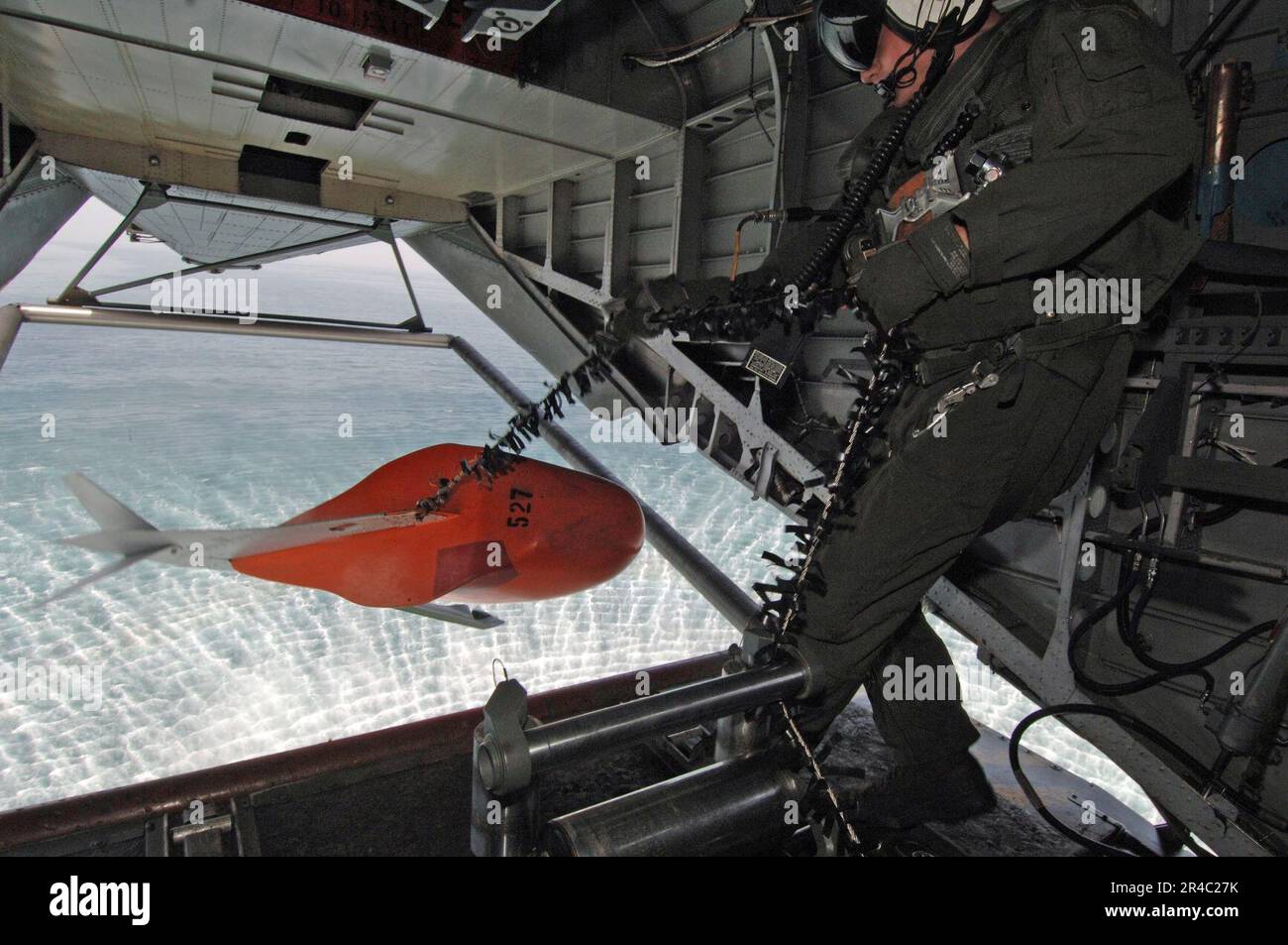 US Navy An air crewman assigned to the Blackhawks of Helicopter Mine ...