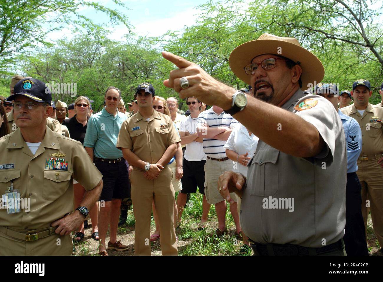 US Navy National Park Service Ranger addresses a group of Sailors from ...