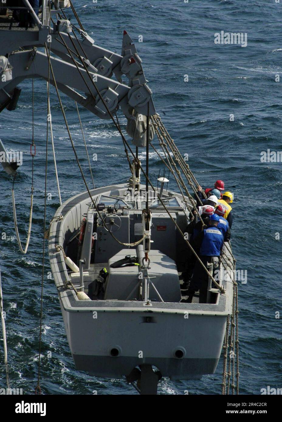 US Navy A Landing Craft Personnel Large (LCPL) is lowered over the side ...