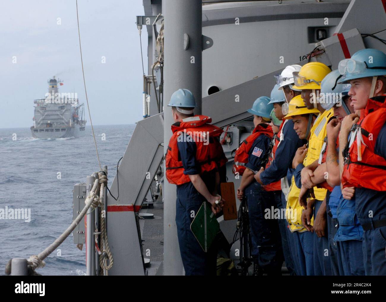 US Navy Amphibious command ship USS Blue Ridge (LCC 19) Sailors line ...