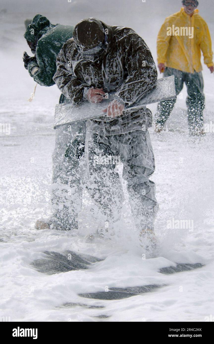 US Navy Aviation Boatswain's Mate Handling 3rd Class inspects sprinkler ...