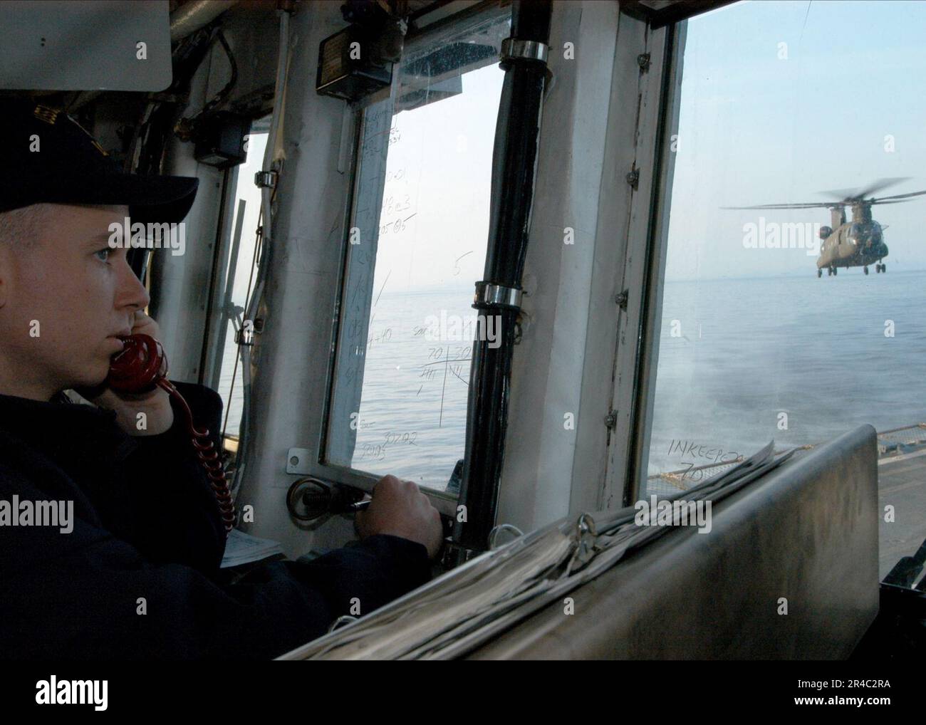 US Navy Lt. j.g. helicopter control officer (HCL) aboard the amphibious ...
