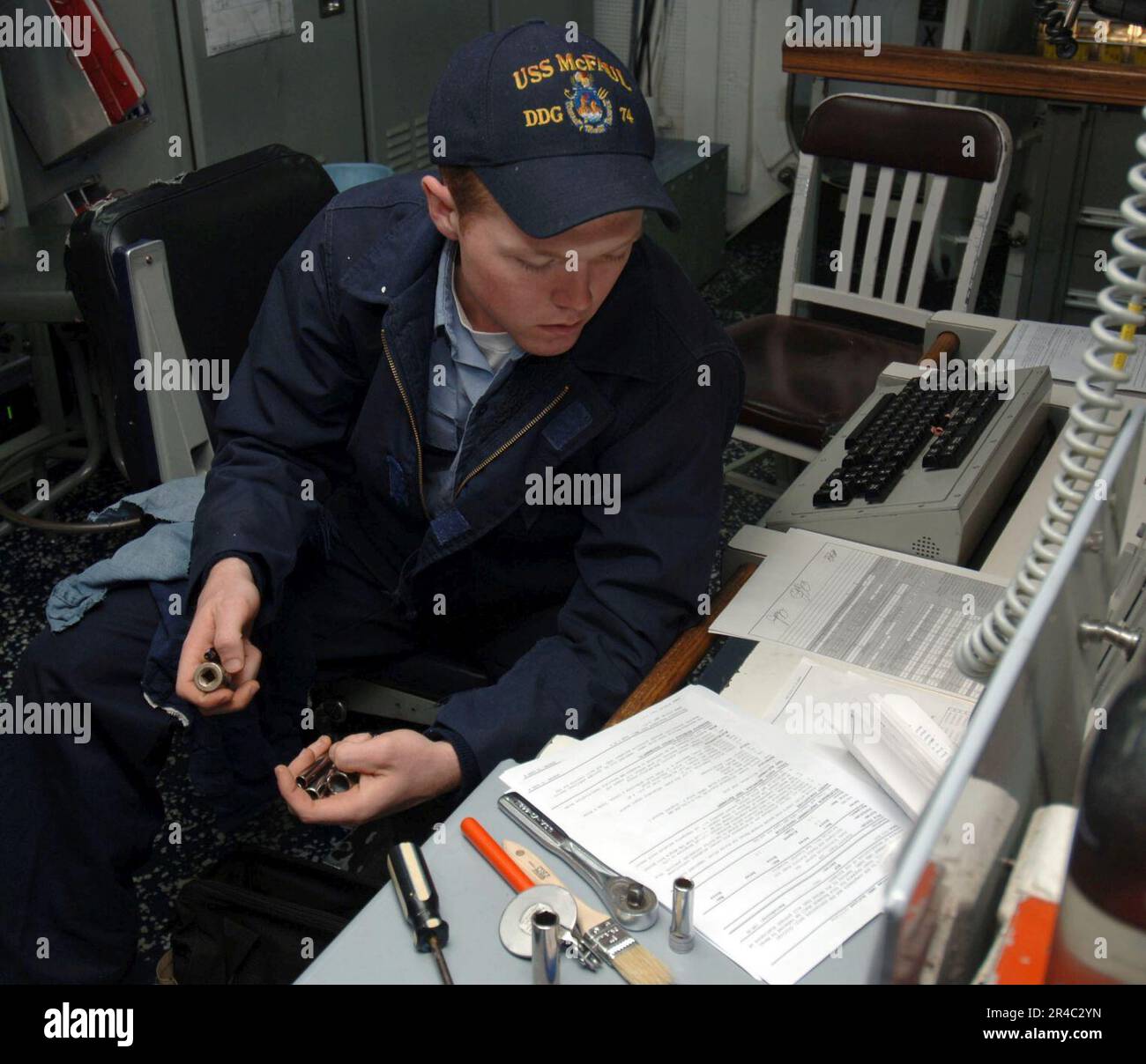 US Navy Gas Turbine System Technician Fireman lays out his tools for a ...
