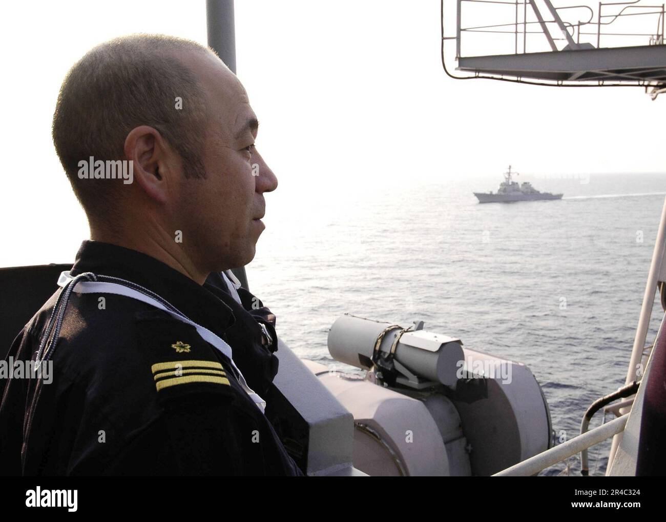 US Navy Japan Maritime Self Defense Force (JMSDF) Lt. Cmdr. watches ...