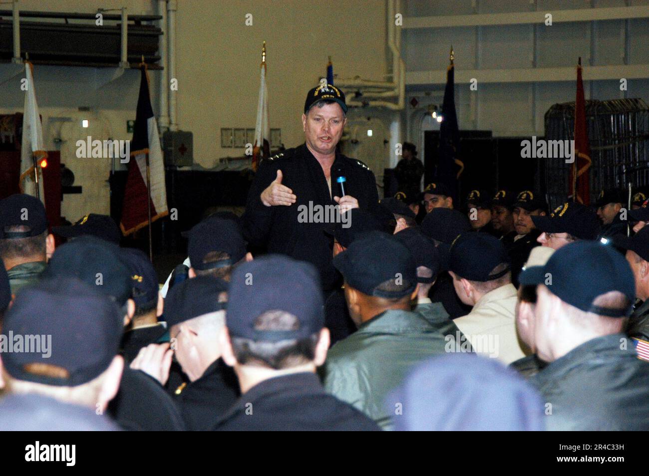 US Navy Vice Adm. Walter Massenburg addresses Sailors in the hanger bay ...