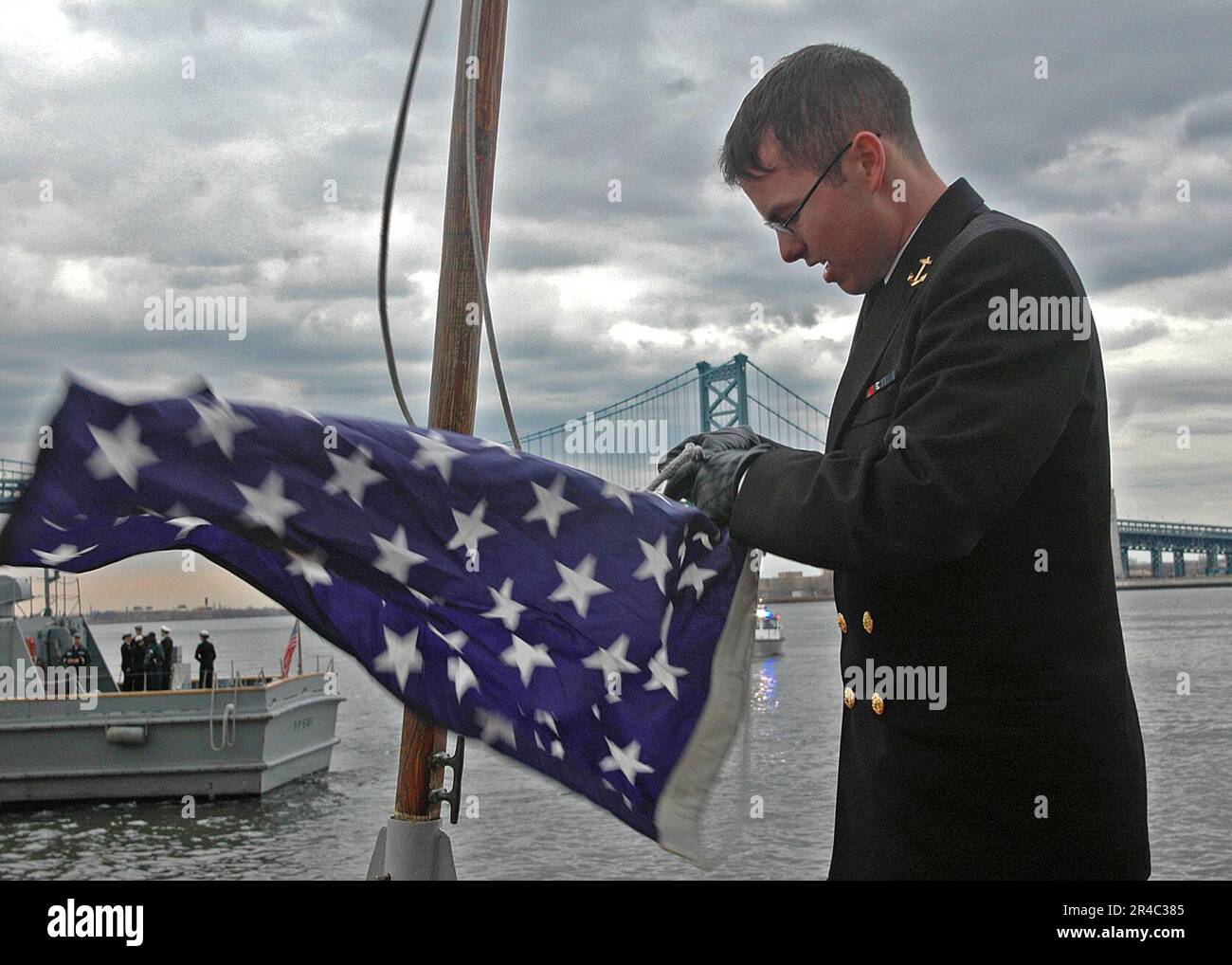 US Navy Midshipman 4th Class raises the Union Jack aboard Yard Patrol ...