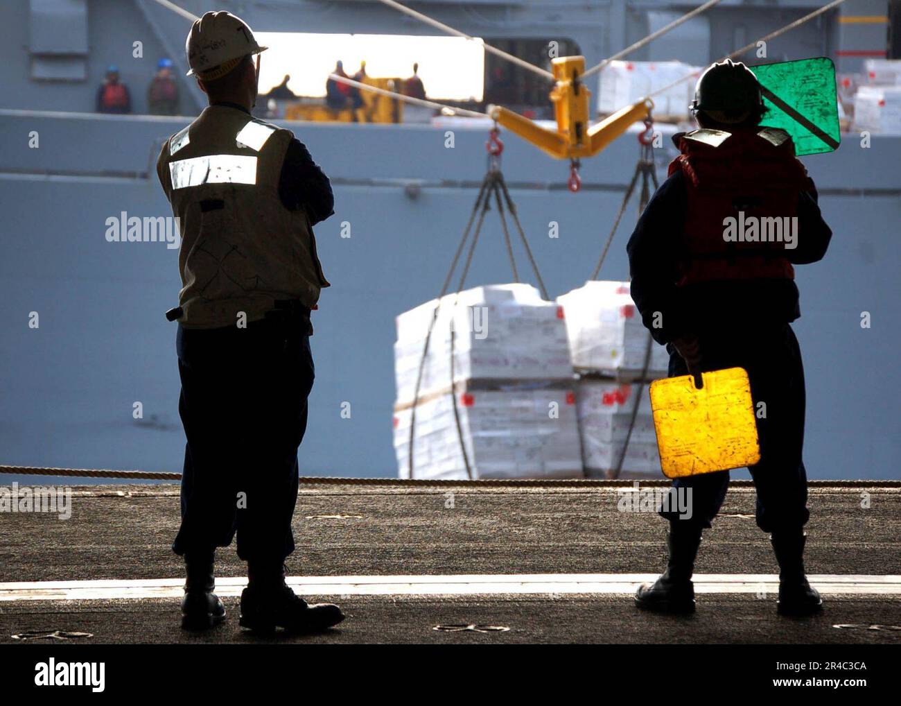 US Navy A signalman stationed aboard the Nimitz-class aircraft carrier ...