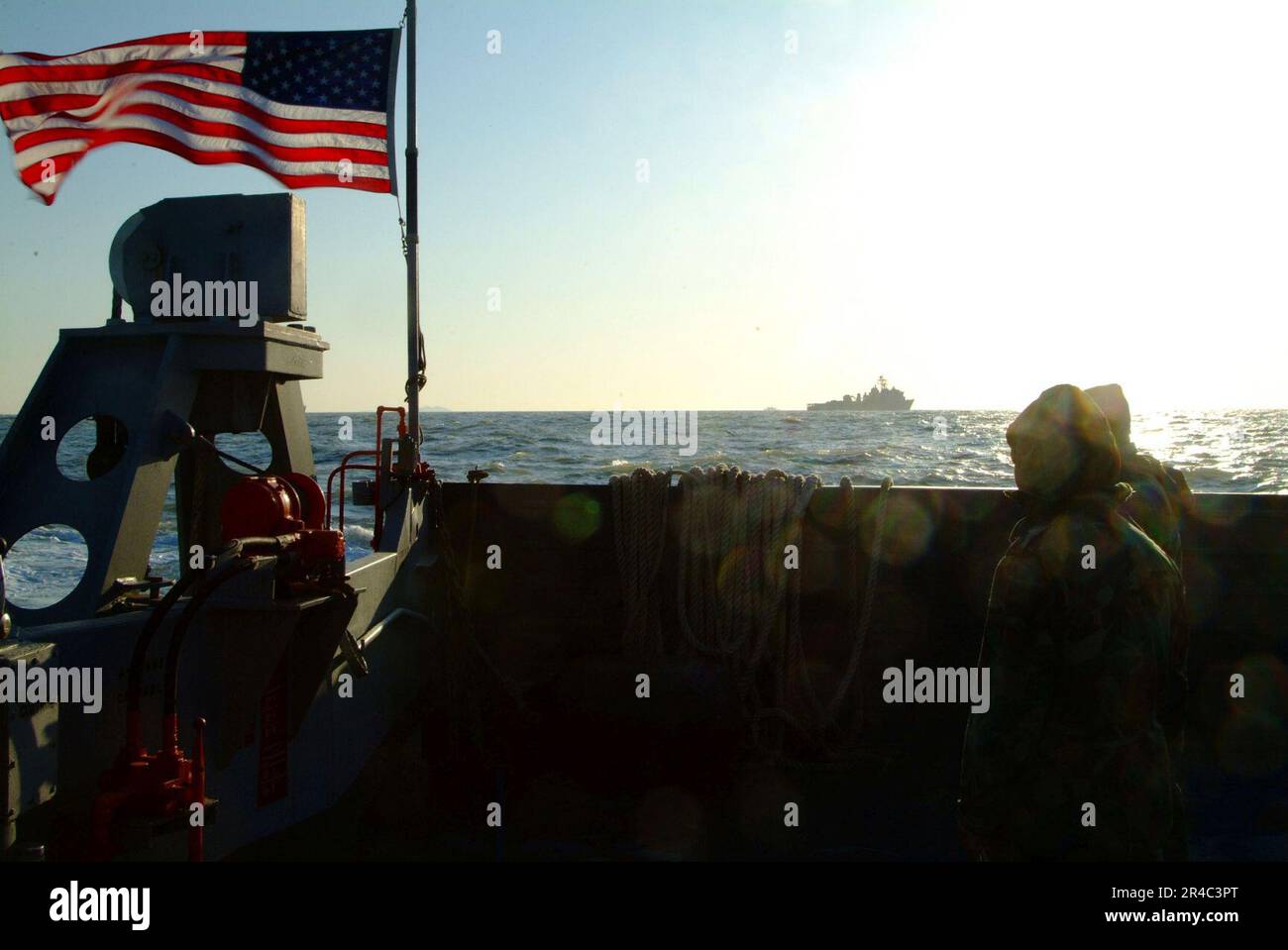 US Navy Sailors assigned to the Assault Craft Unit One (ACU-1) look out ...