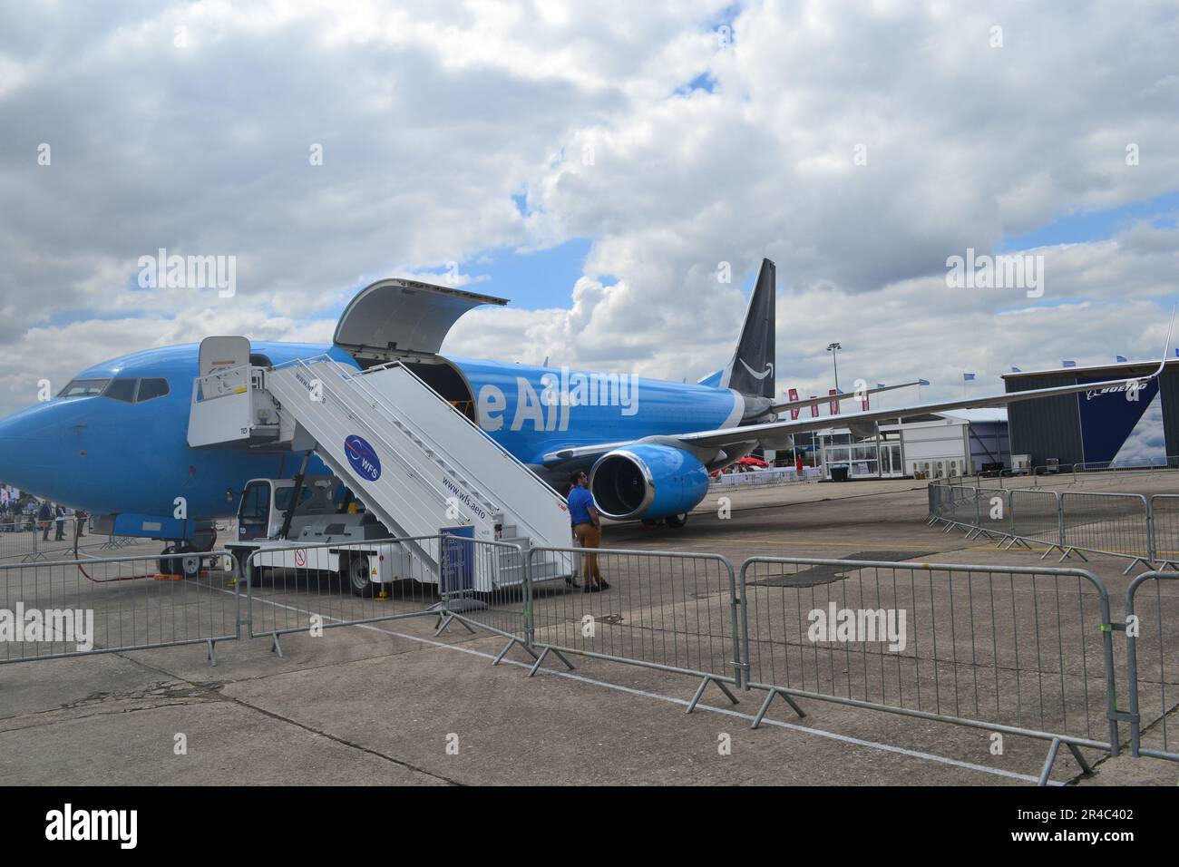 An airplane is pictured on the tarmac with an extended boarding ladder ...