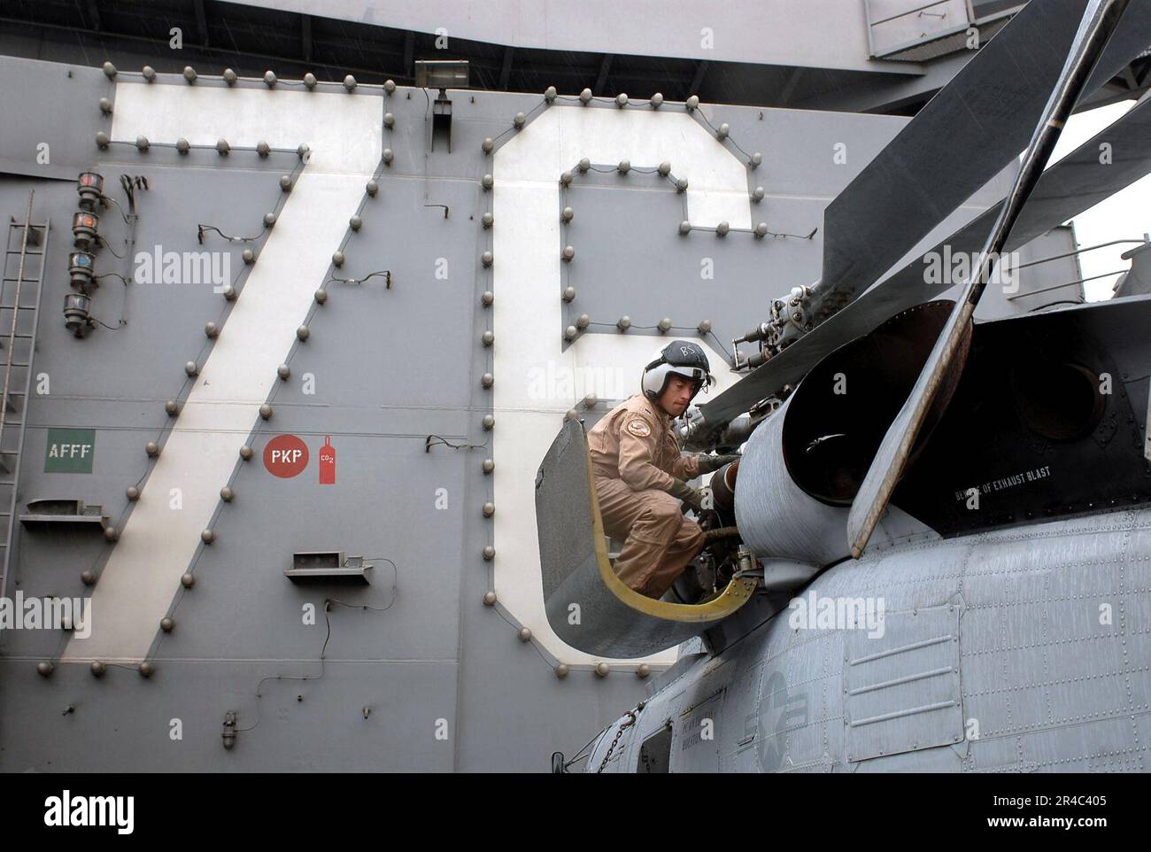 US Navy Lt.j.g. performs a pre-flight inspection of an SH-60 Seahawk ...