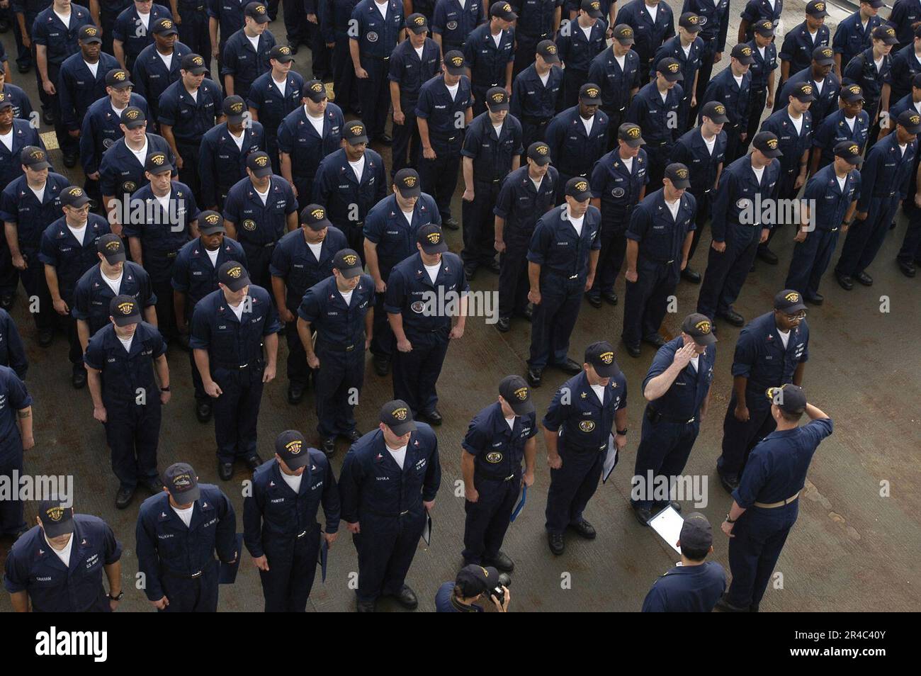 US Navy Sailors assigned to the submarine tender USS Emory S. Land (AS ...