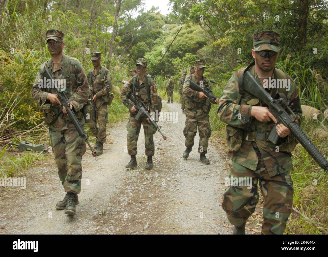 US Navy Seabees assigned to Naval Mobile Construction Battalion Four (NMCB-4) execute security ...