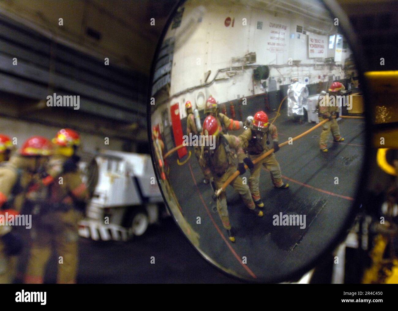 US Navy Fire fighters aboard the amphibious assault ship USS Tarawa ...