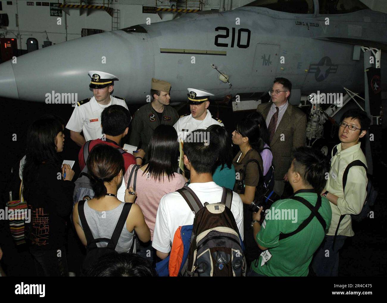 US Navy U.S. Navy photographic officer, Lt. takes questions from local ...