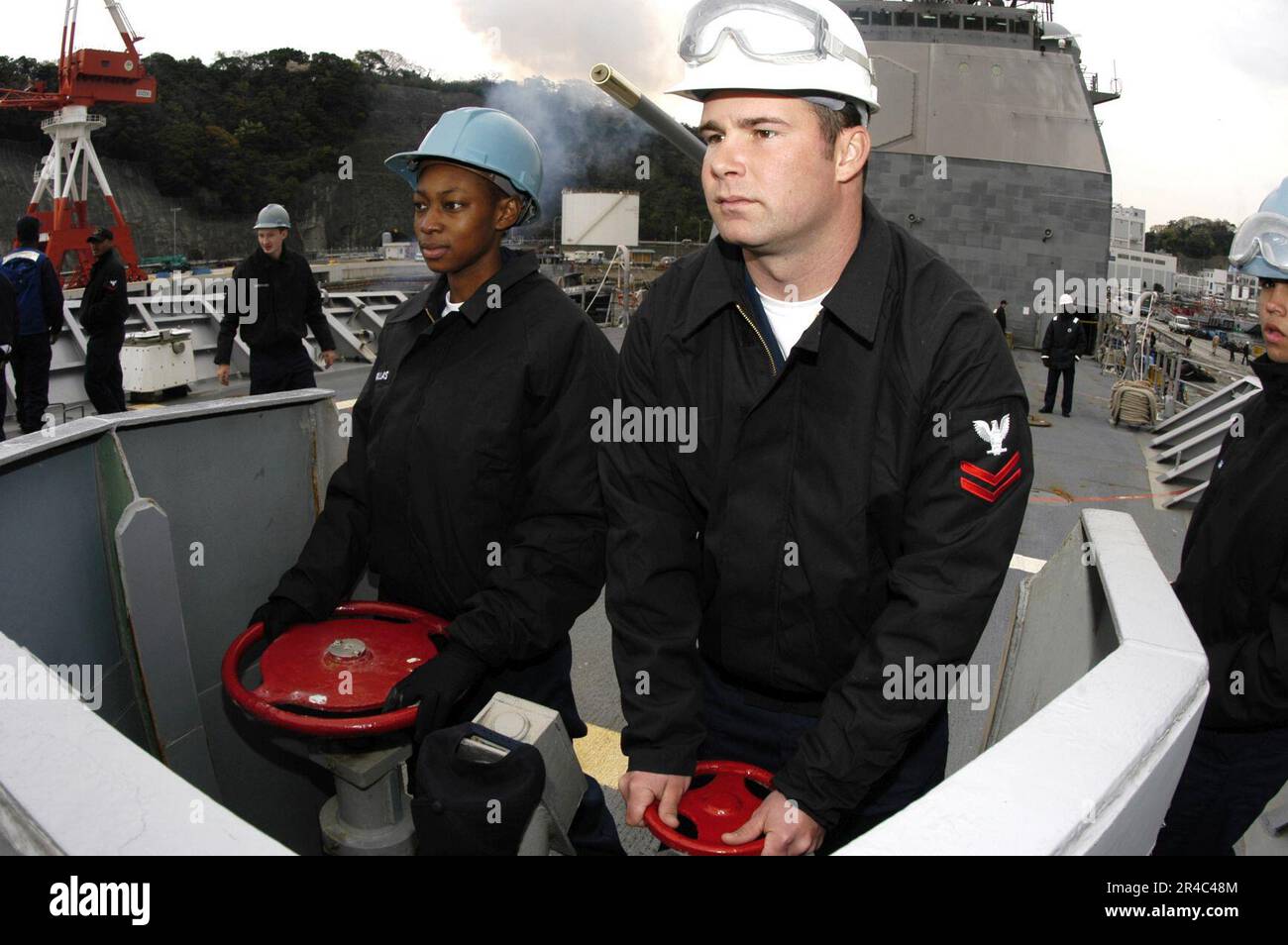 US Navy Boatswain's Mate Seaman and Boatswain's Mate 2nd Class operate ...