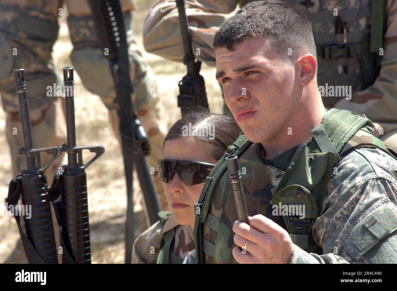 US Navy Sailors listen closely as Army drill instructors provide combat ...
