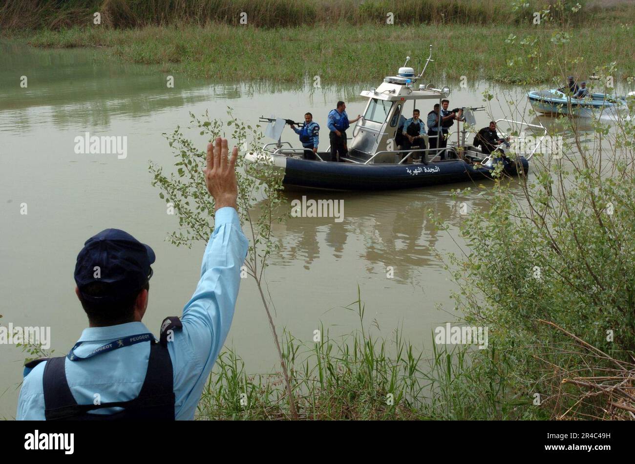 US Navy Iraqi Police River Unit conduct a joint mission with the ...