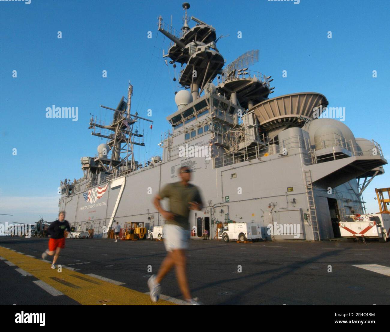 US Navy Sailors assigned to the multi-purpose, amphibious assault ship ...