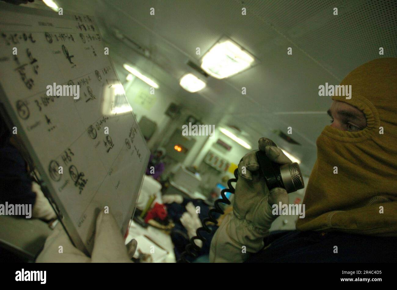 US Navy Damage Control Assistant, Lt. Cmdr. uses the 1MC system to ...