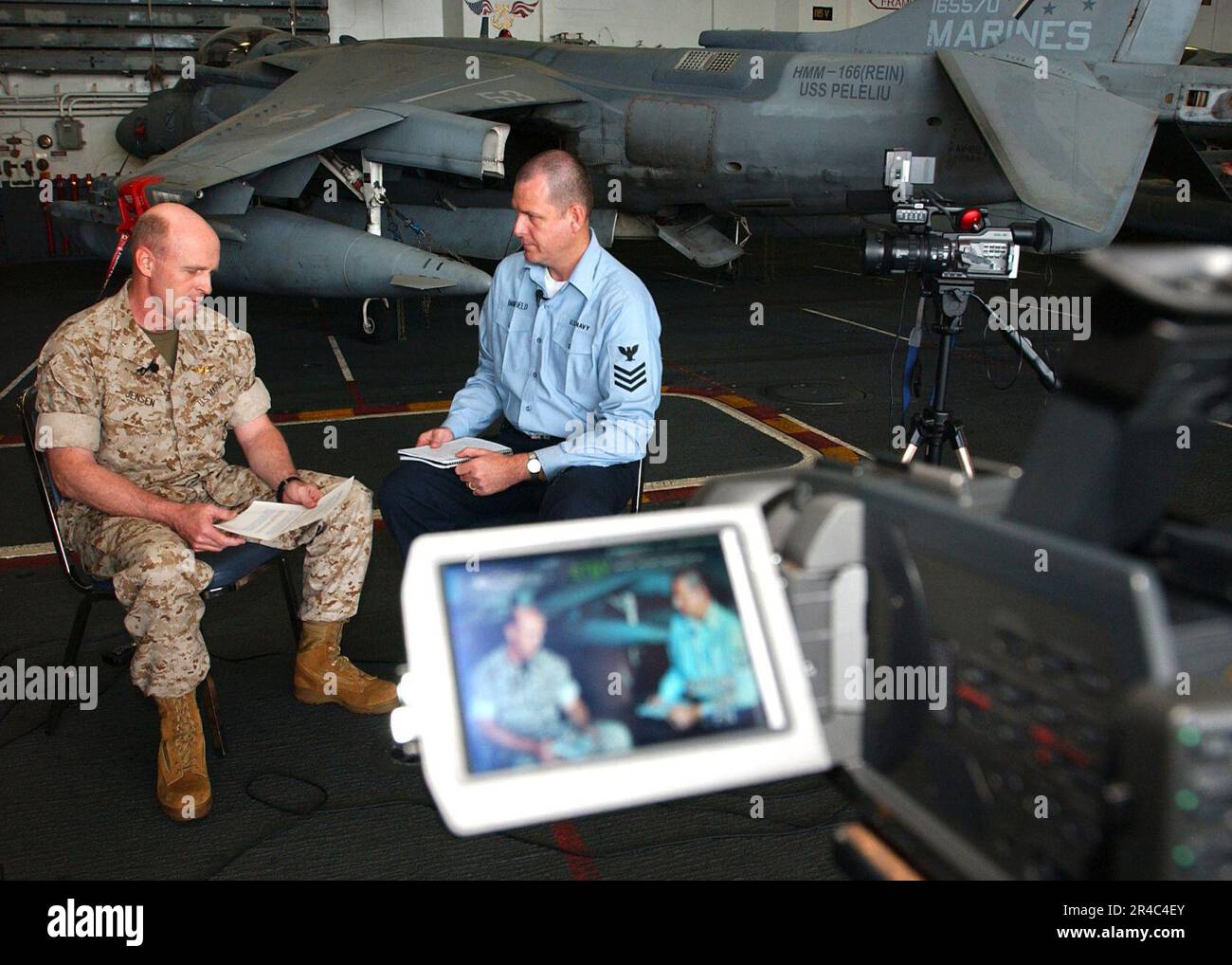 US Navy Brig. Gen. Carl B. Jensen gets interviewed by Lithographer 1st ...