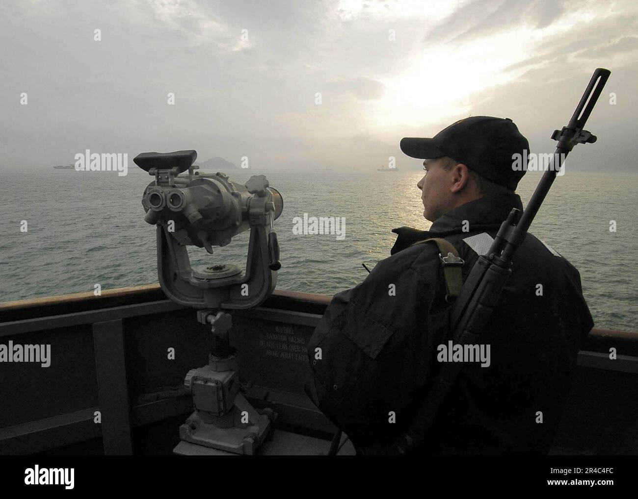 US Navy Gunner's Mate 2nd Class monitors surface contacts in Hong Kong ...